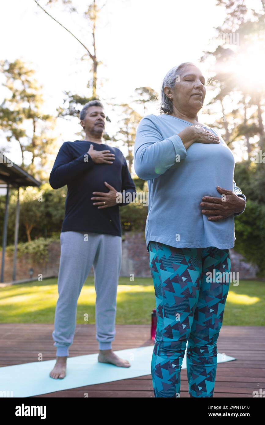 Standing senior woman stretching hi-res stock photography and images ...