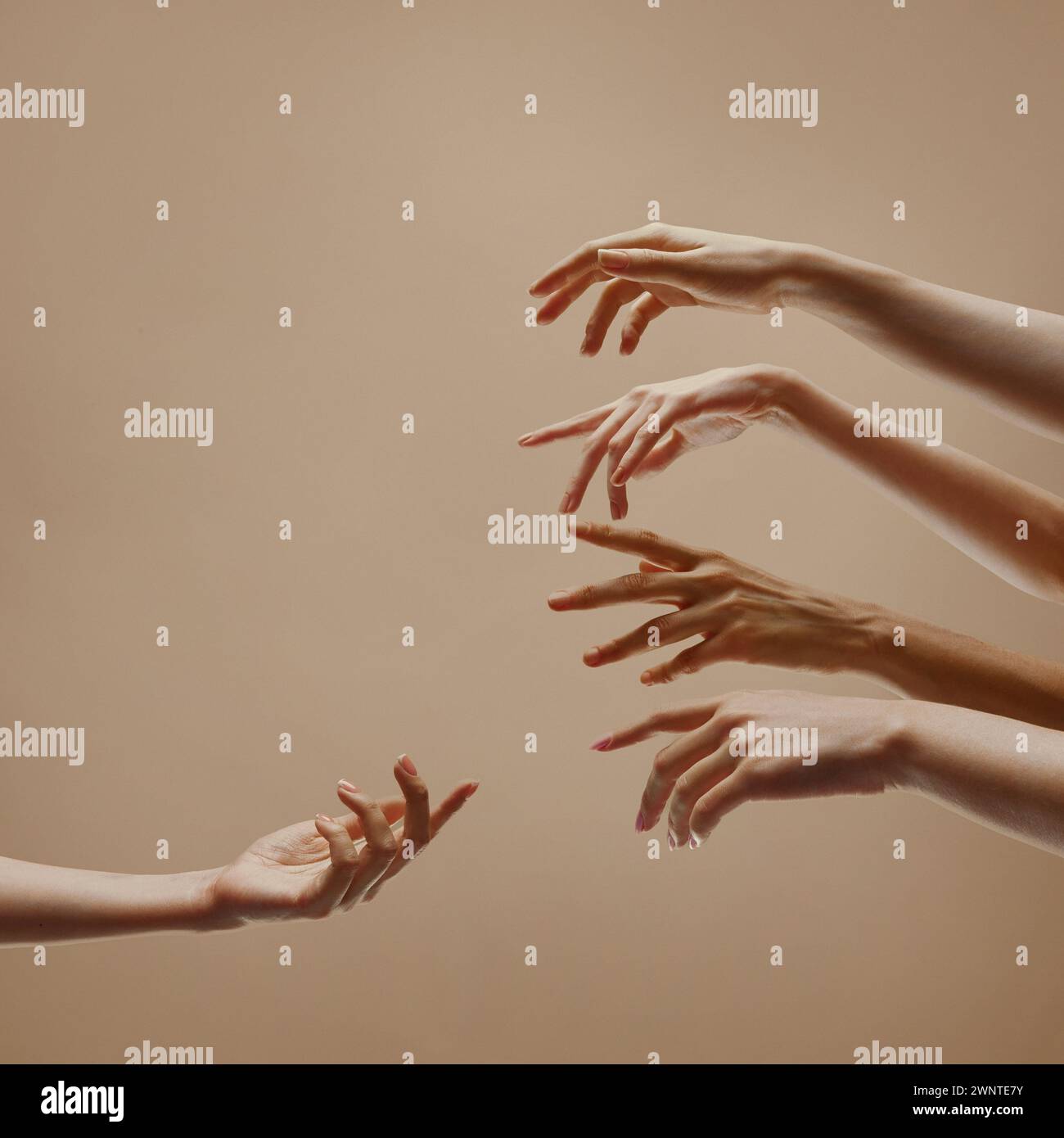 One hand reaching to other hands symbolizing support, community against ...