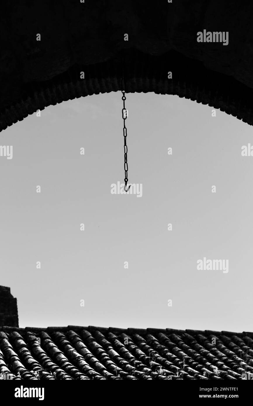 Iron chain hanging from The Miradeiro Arch in Elvas town, Portugal ...
