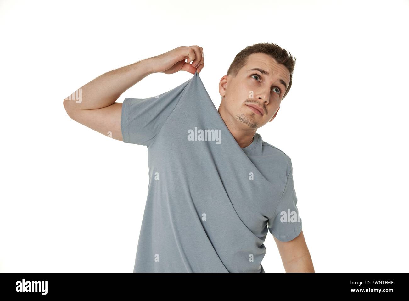 man holding himself by the shoulders isolated on white background Stock ...