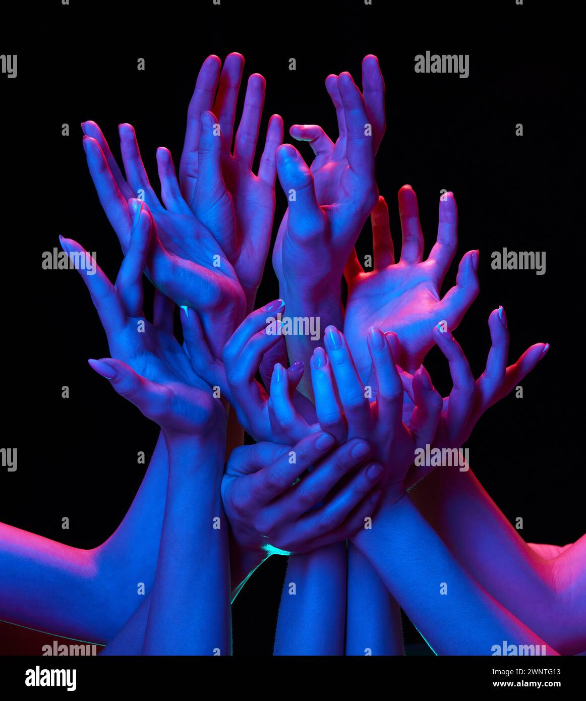 Group of hands reaching upwards showing uplifting and supportive in ...