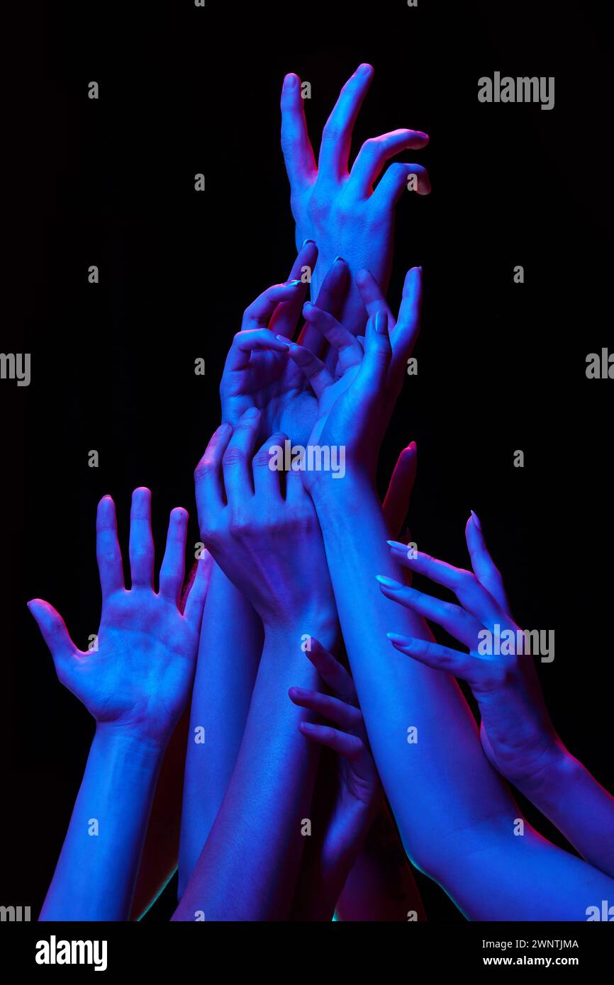 Group of well-groomed tender hands reach out to each other in ...