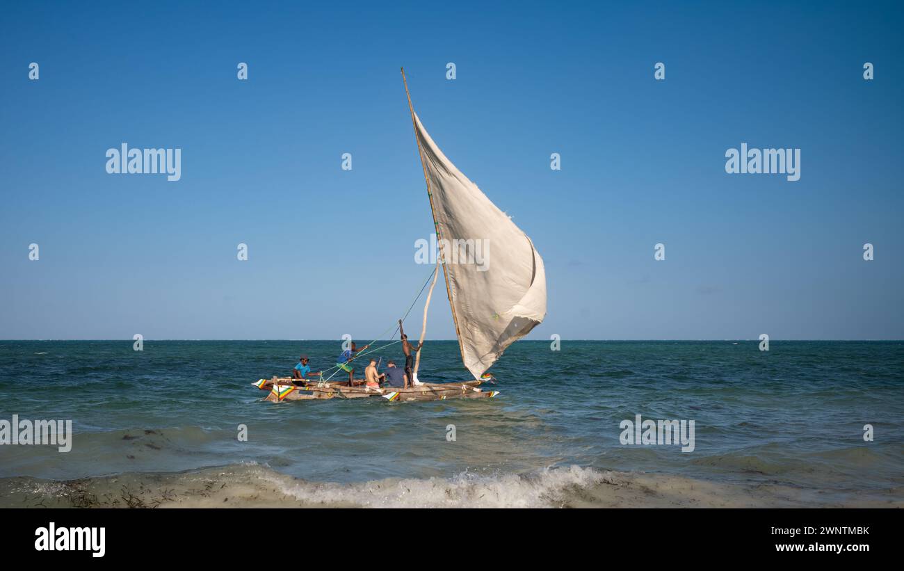 Fishermen take western tourists for a trip in their traditional sailing ...