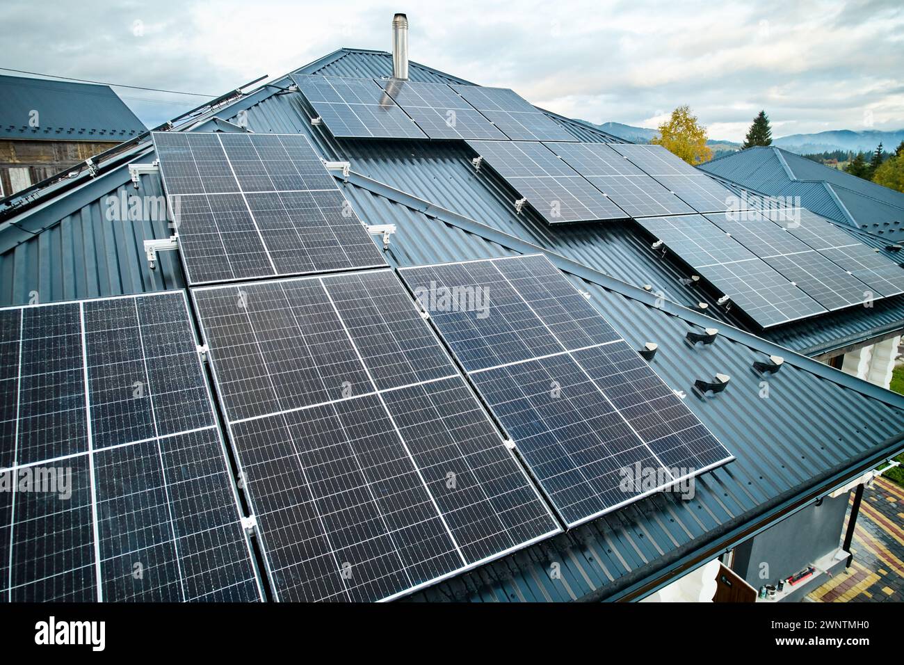 Photovoltaic solar panel system on the roof of house. Modern solar ...
