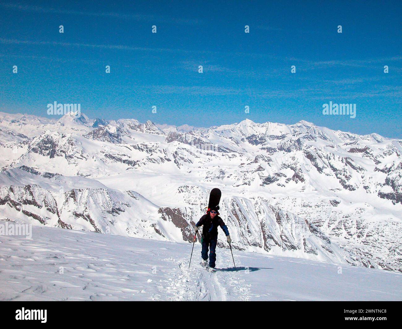 alpine snowboard tour in a white snowy landscape with blue sky alpine ...
