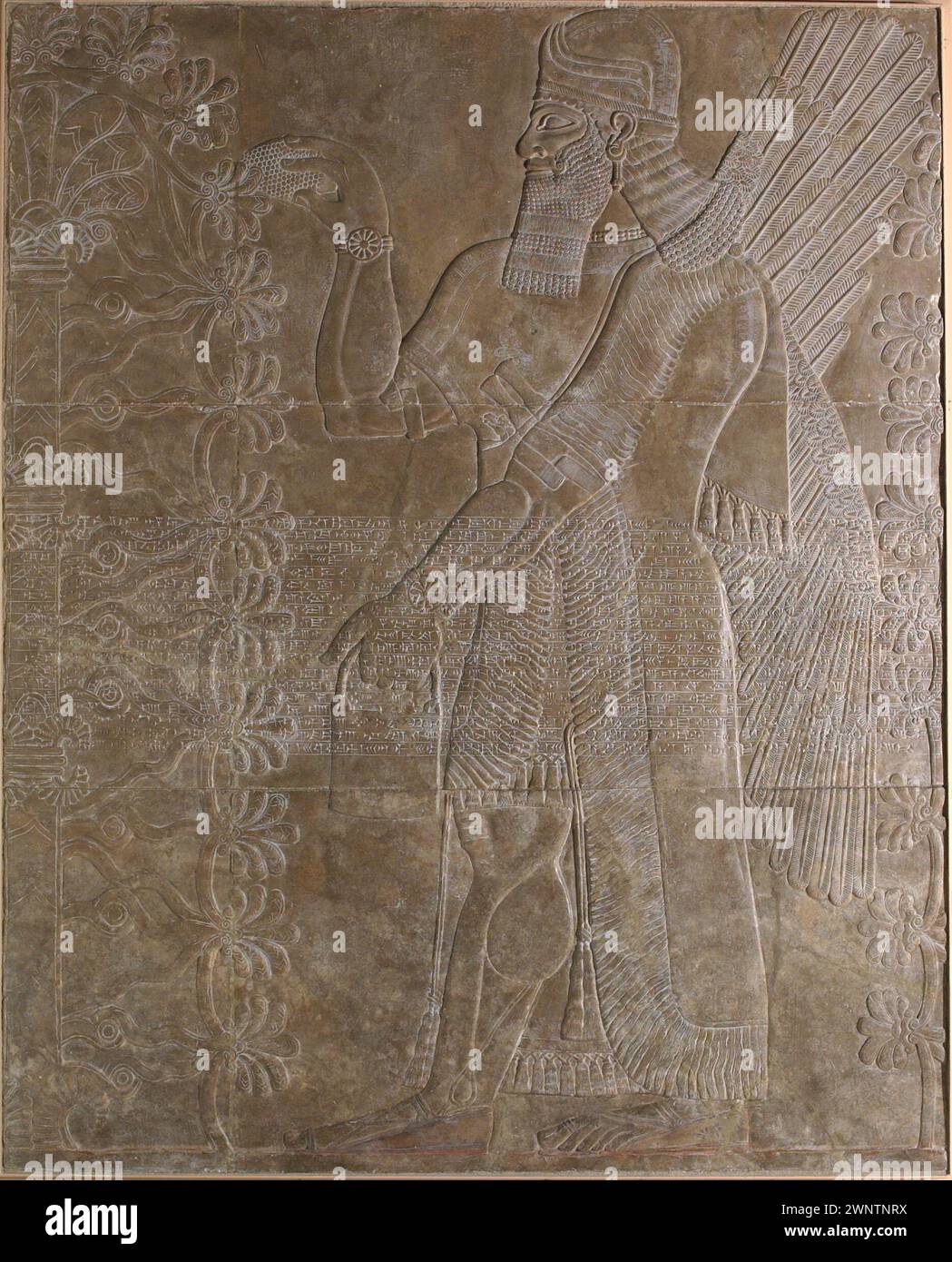 Relief: Human-headed genie watering sacred tree 883–859 B.C. Nimrud ...