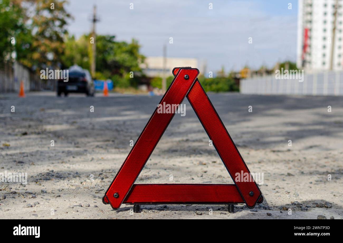 Red triangle, red emergency stop sign, red emergency symbol on road ...