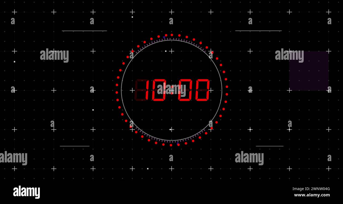 Image of red digital timer changing with dots and circles on black ...