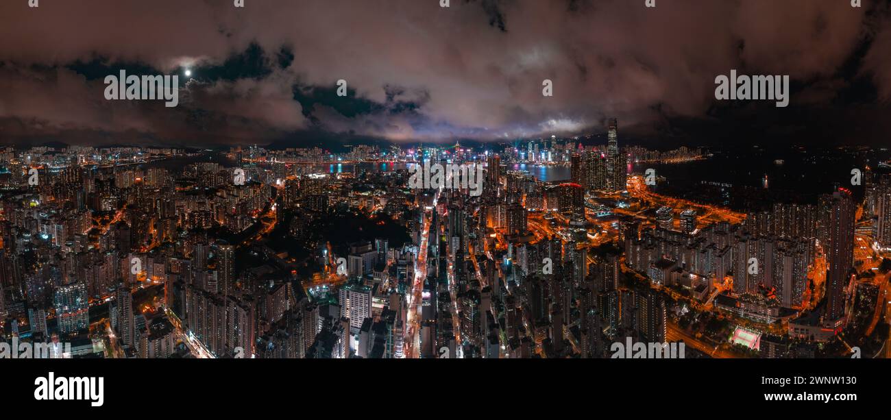 Aerial night view of the Kowloon area in Hong Kong during full moon ...