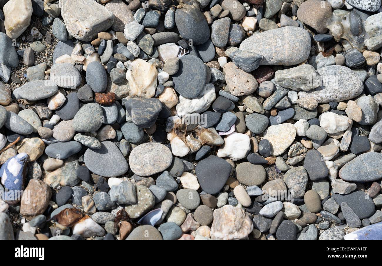 pebbles, surface next to the ocean background wallpaper Stock Photo - Alamy