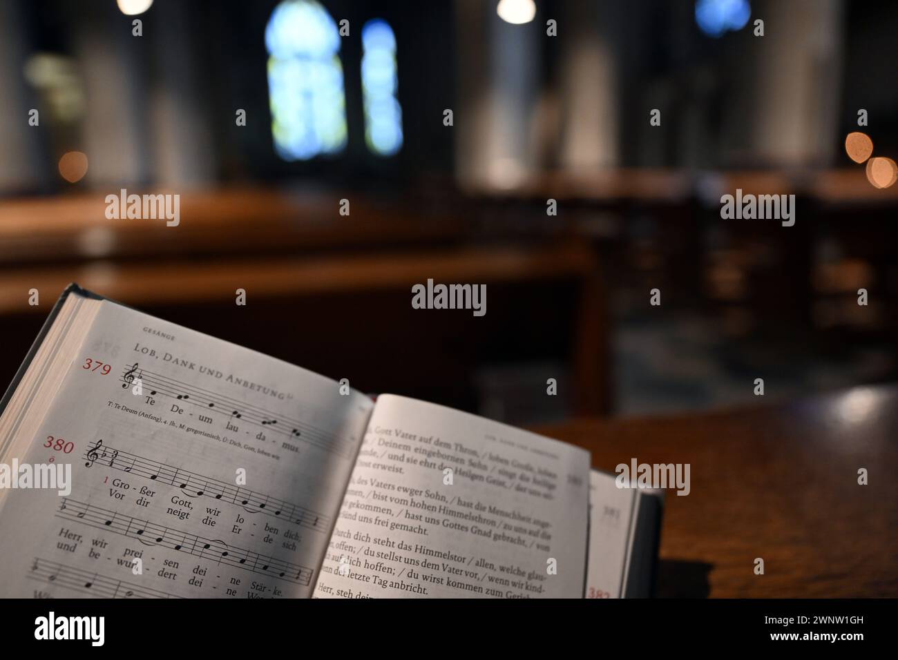 Essen, Germany. 04th Mar, 2024. An open hymnal lies on a church pew ...