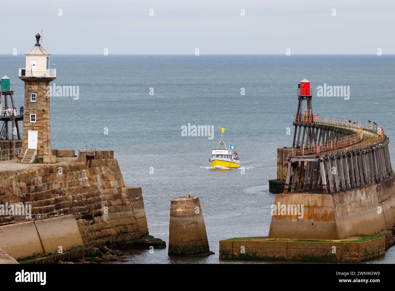 A boat approaching Whitby harbour Stock Photo - Alamy