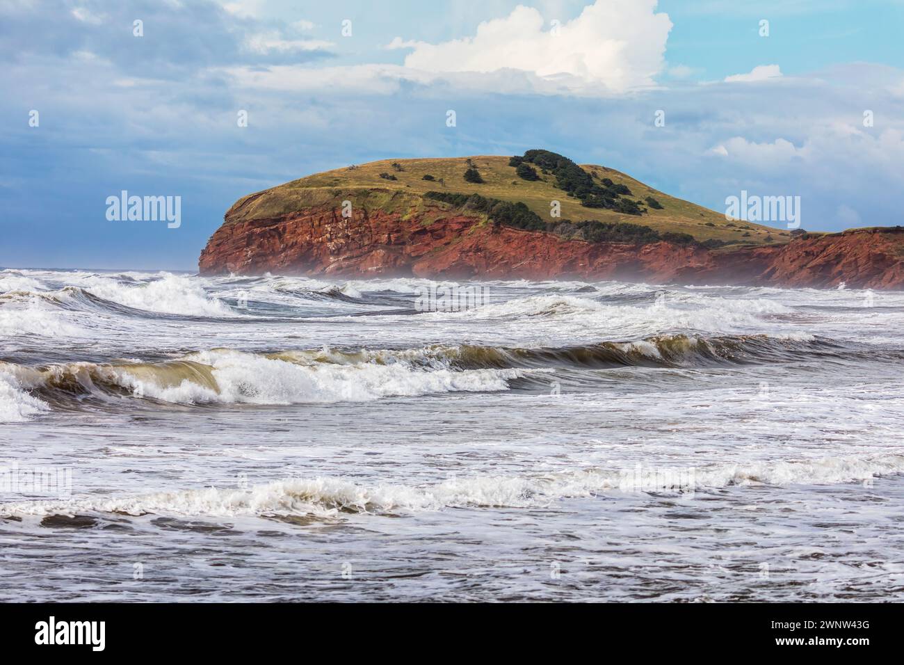 The colourful sandstone cliffs and choppy seas of Havre Aubert ...