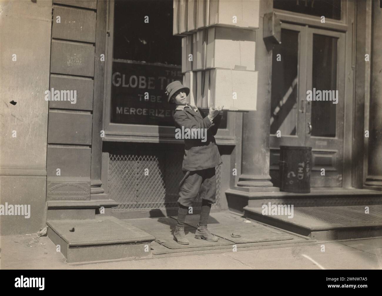 ewis Hine Wagon boy or "tail boy" helping to load the wagon, c. 1914 ...