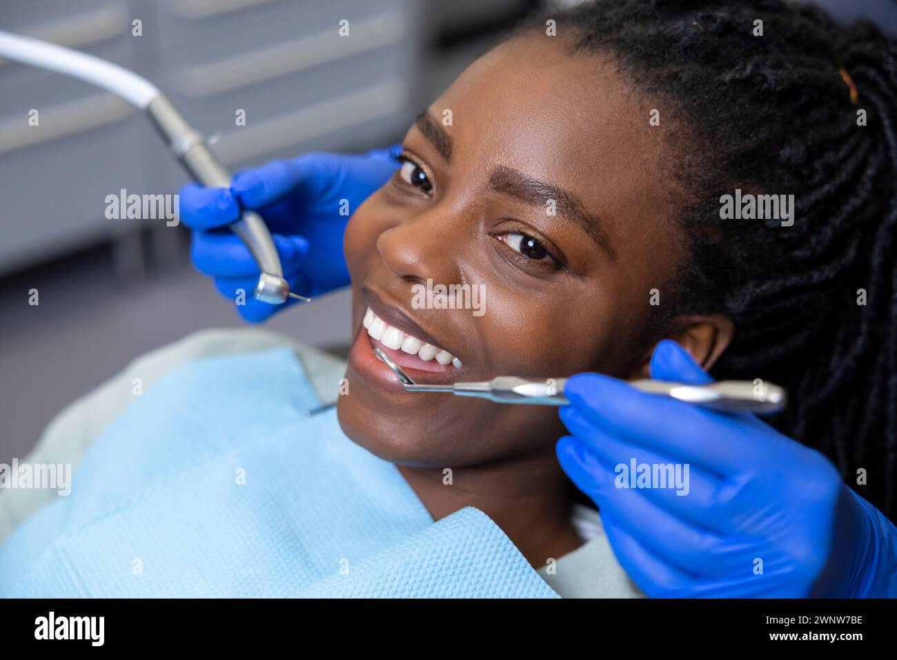 Multicultural lady in dental clinic doing teeth checkup Stock Photo - Alamy