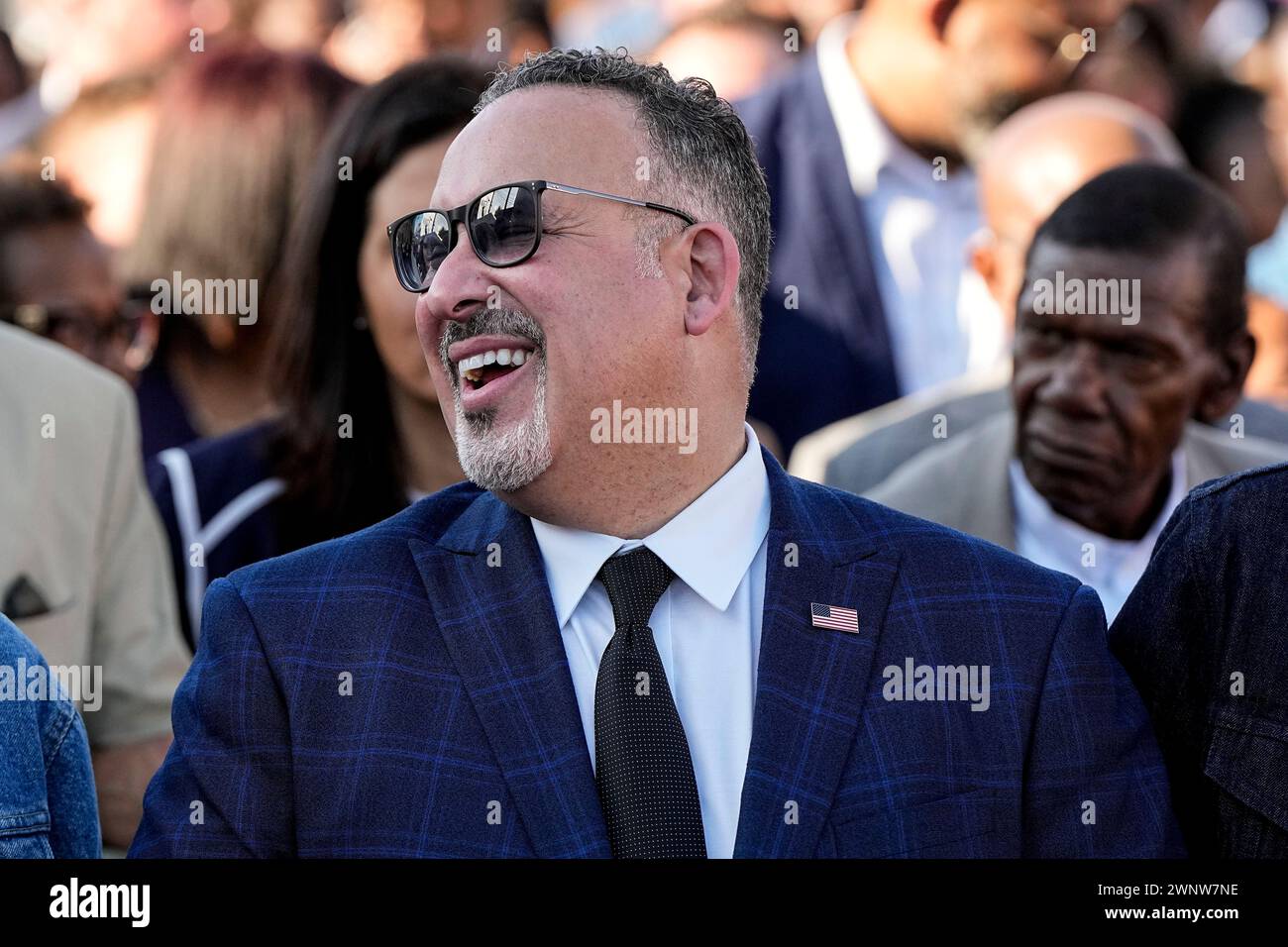 U.S. Secretary of Education Miguel Cardona walks across the Edmund ...