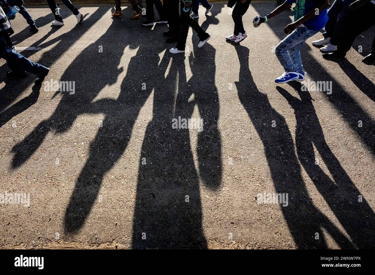People walk across the Edmund Pettus Bridge commemorating the 59th ...