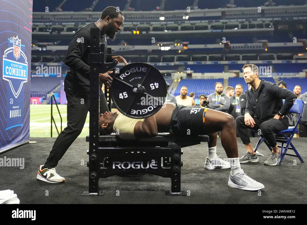 Texas offensive lineman Christian Jones participates in the bench press ...