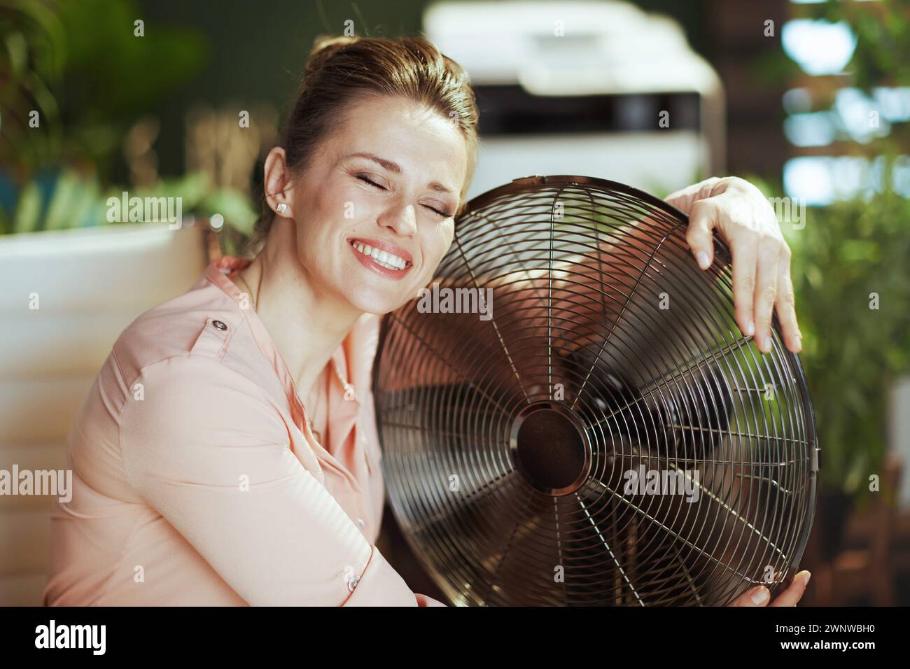 Sustainable workplace. happy modern middle aged woman employee in ...