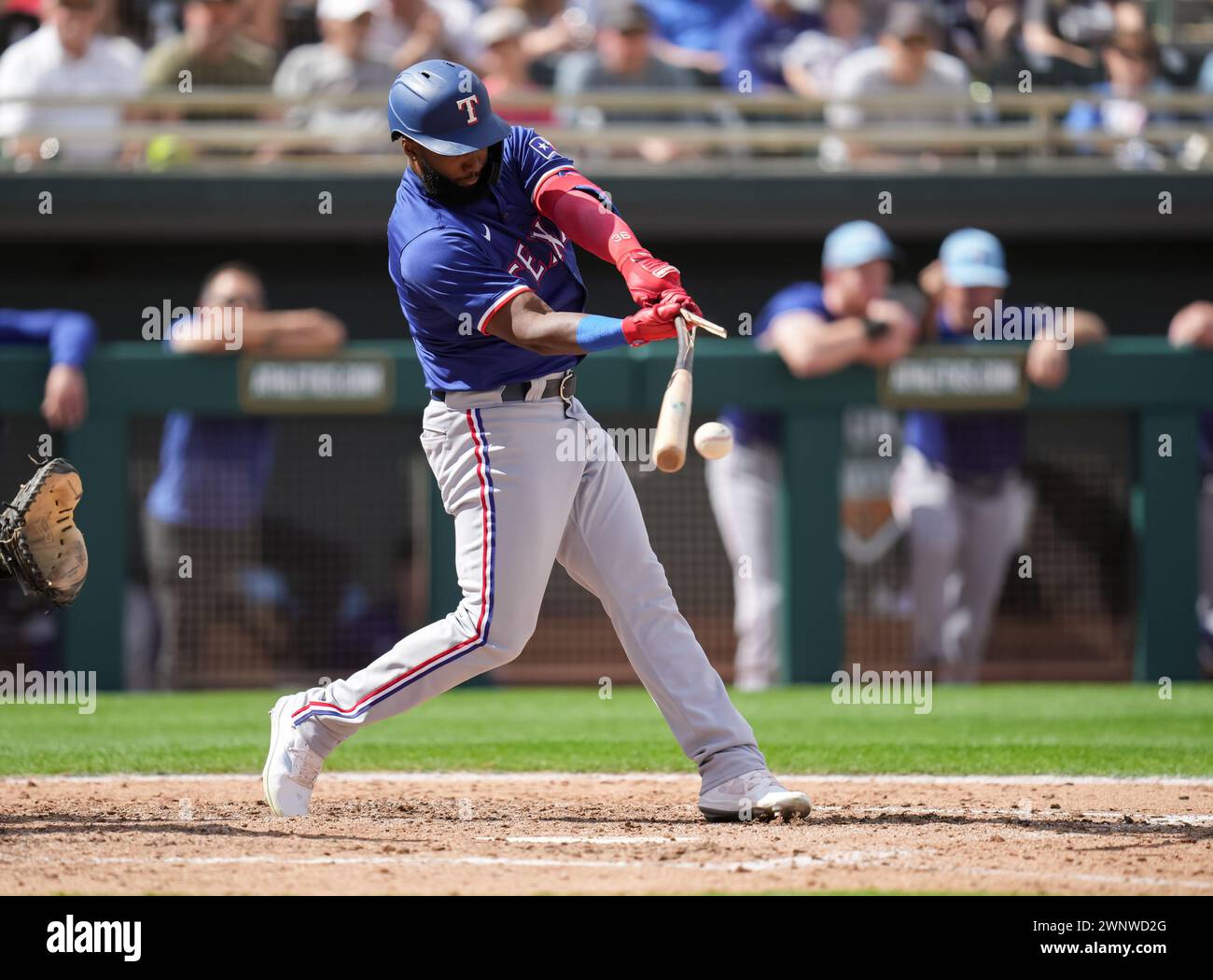 Texas Rangers players gets a single while his batt breaks MLB spring ...