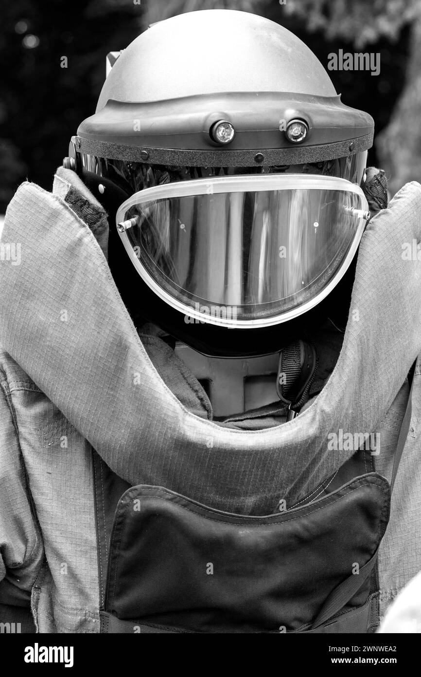 Armor costume consisting of a steel helmet. The concept of demining of ...