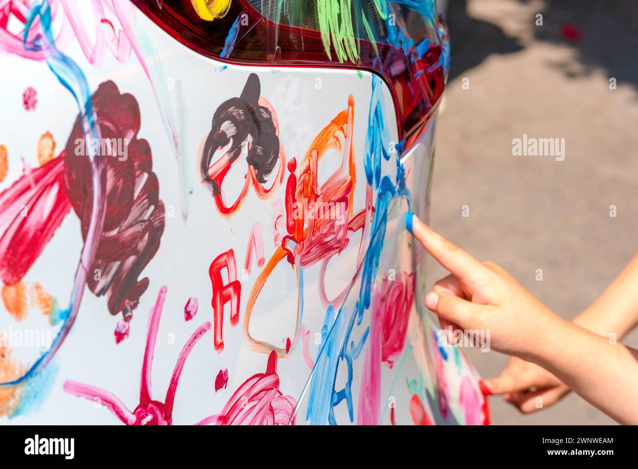 draw on a car. finger painting. outlined car. painted car Stock Photo ...