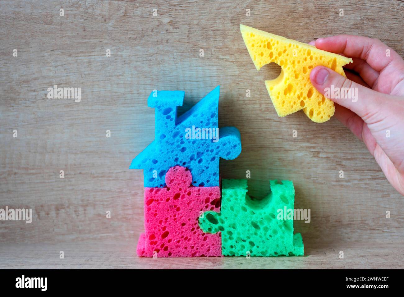 Hand holds part of the house. Creation and design of dwelling ...