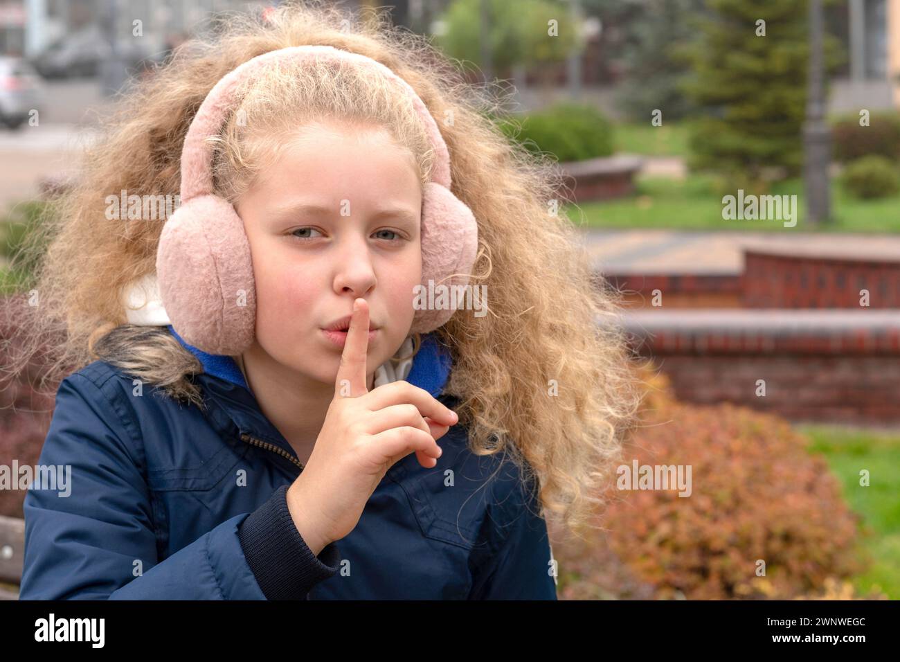 Gloomy child. The upset kid hands closes ears. The concept the little ...