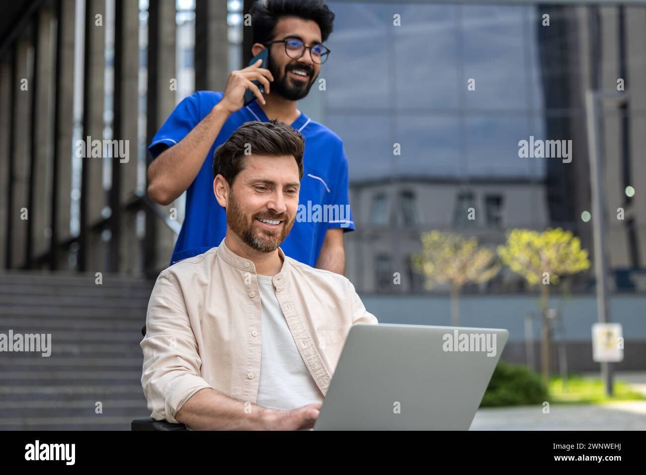 Disabled self-employed man working on laptop while sitting in ...