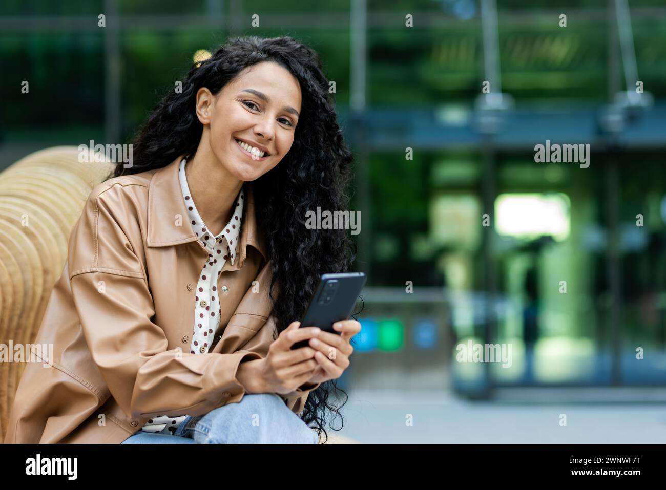 Female engaging smartphone amidst hi-res stock photography and images ...