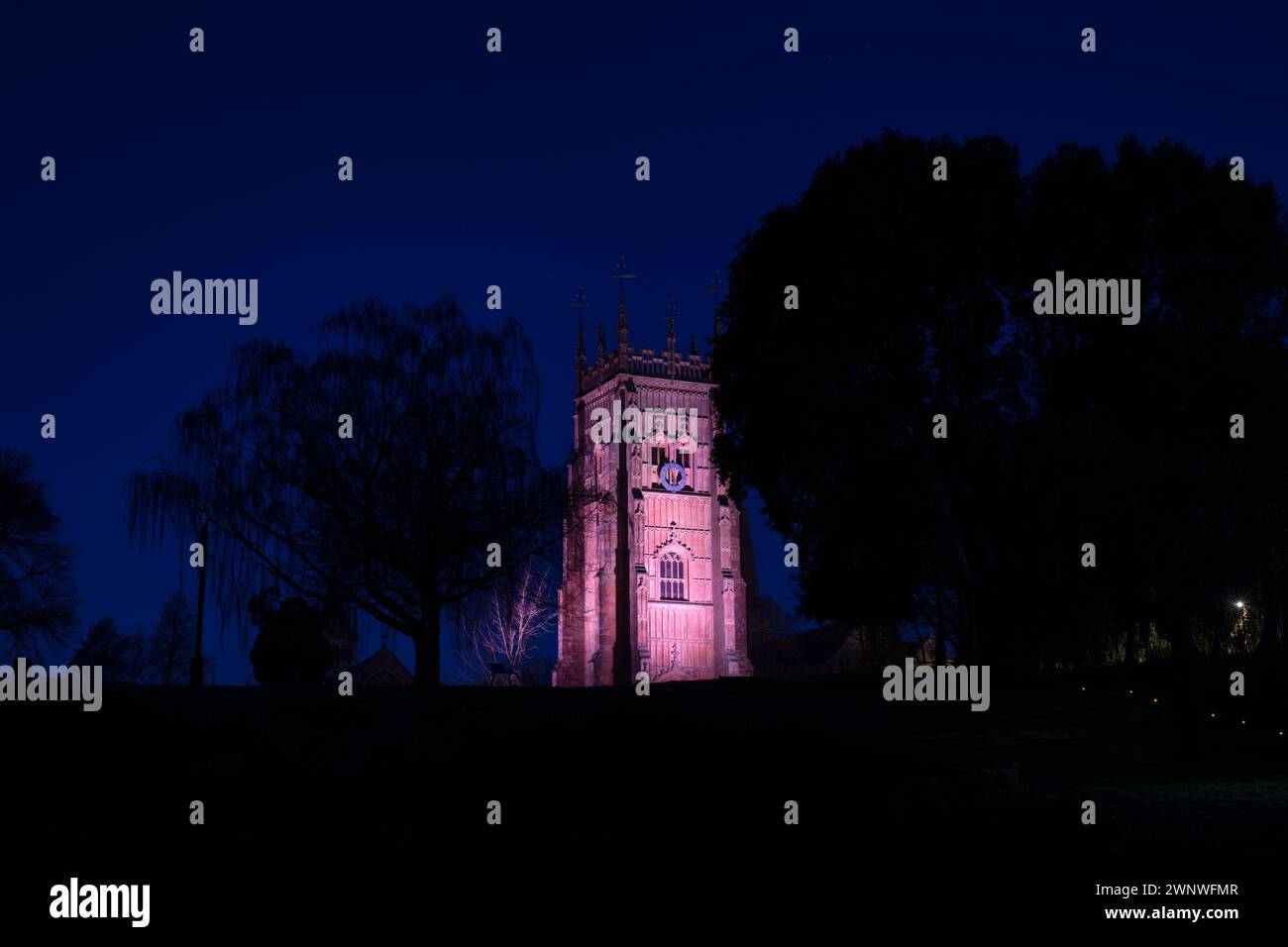 Evesham Bell Tower lit up in march before dawn. Evesham, Wychavon, Worchestershire, England ...