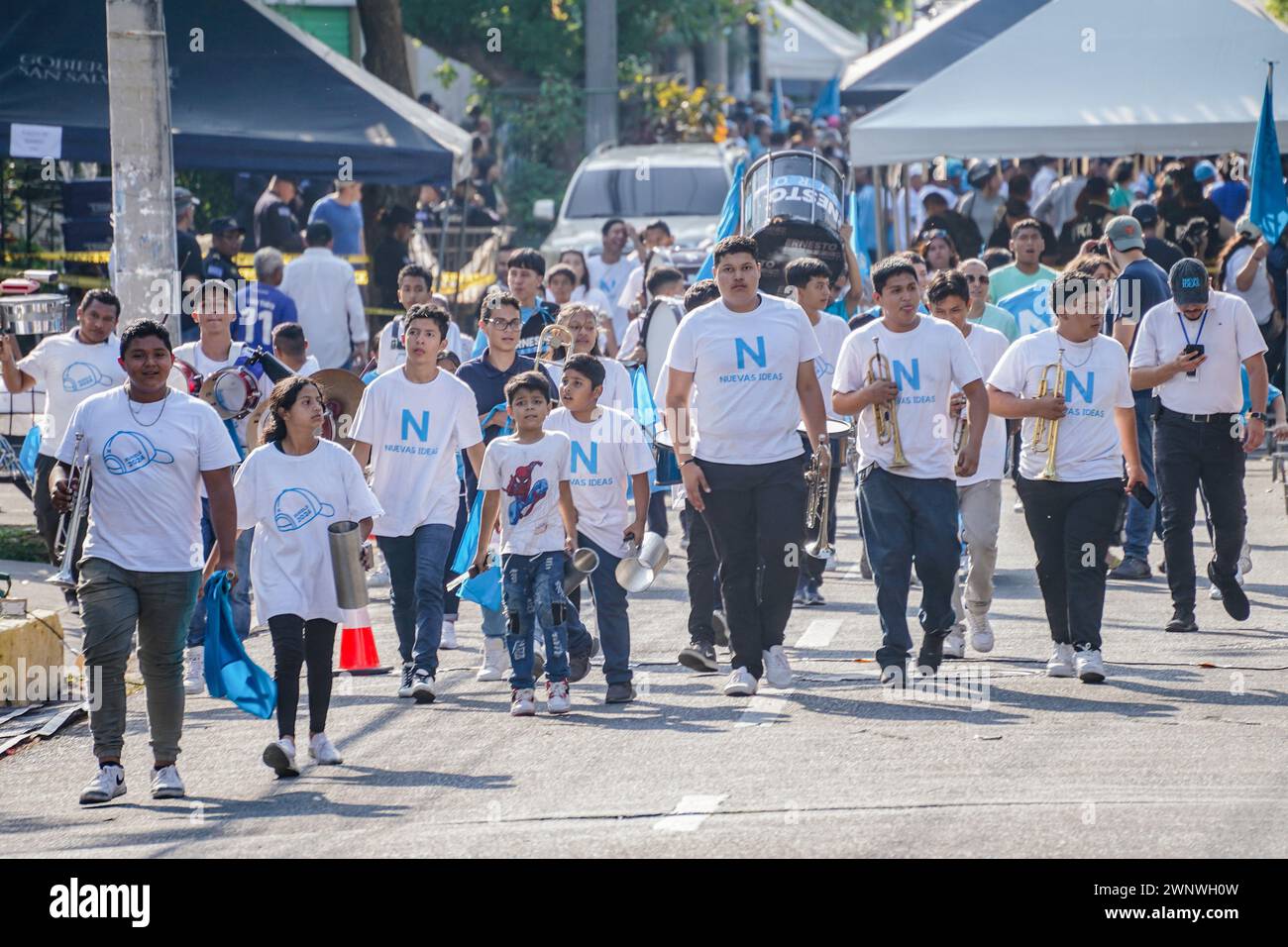 Nayib Bukele supporters run before the arrival of President Bukele to a ...