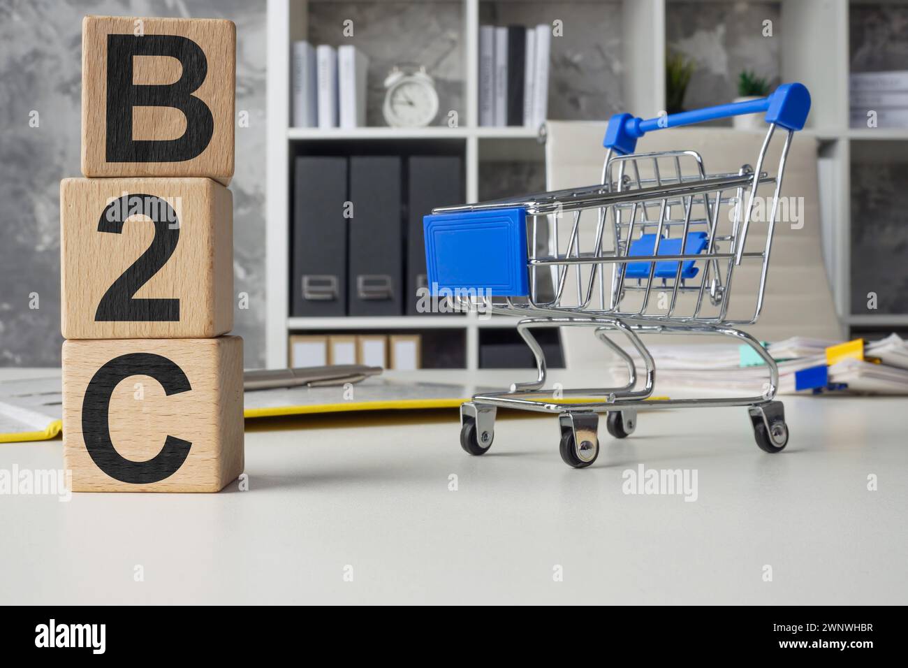 Cubes B2C Business to Consumer and shopping cart Stock Photo - Alamy