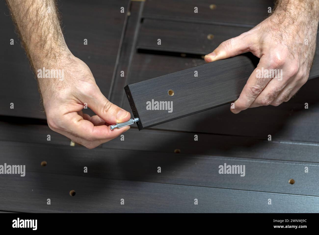 Hand and fittings. Inserting wood joints. Installation of wooden ...