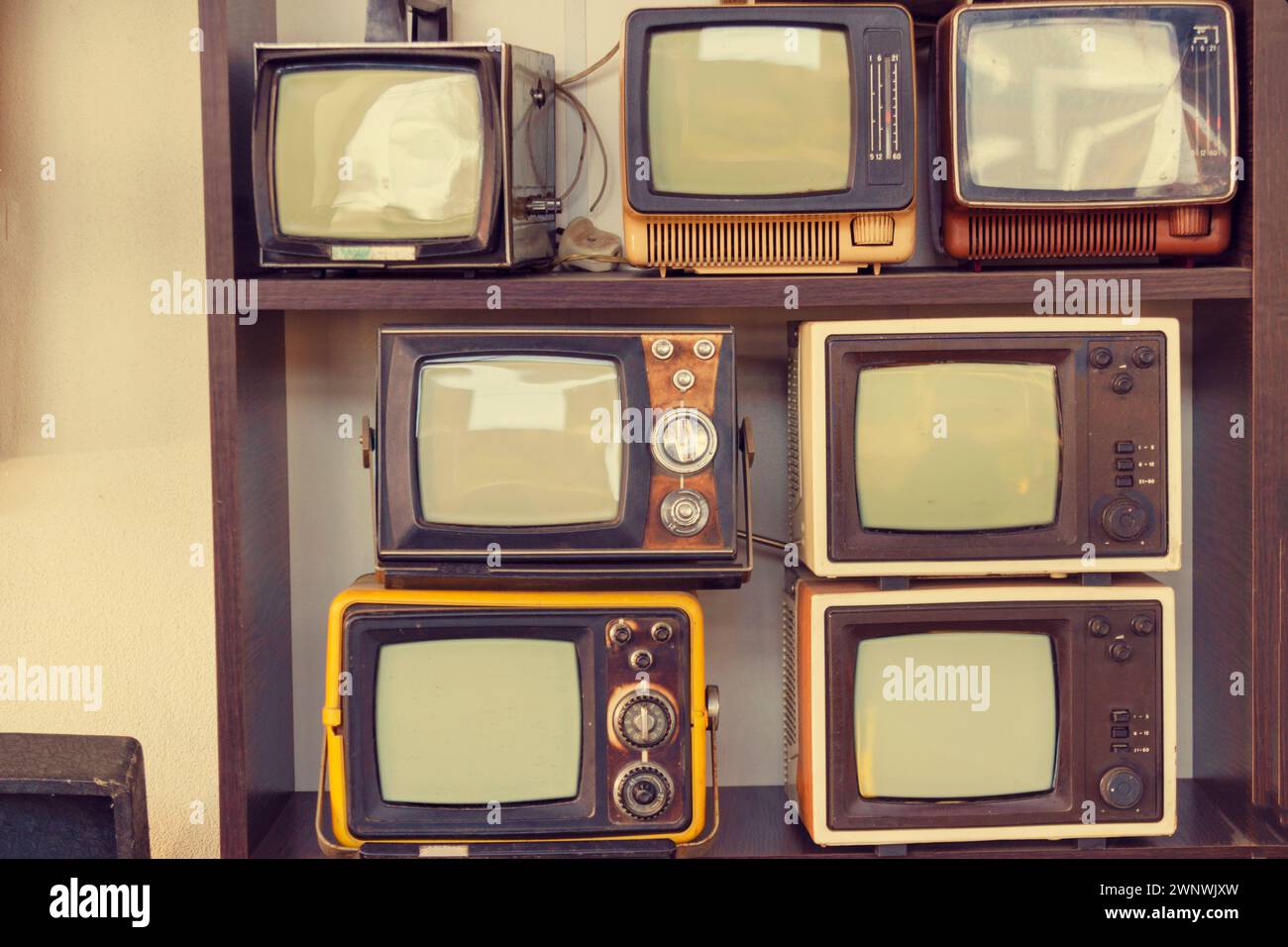Many retro television. vintage old TV is colorful multi-row. Seeing the ...