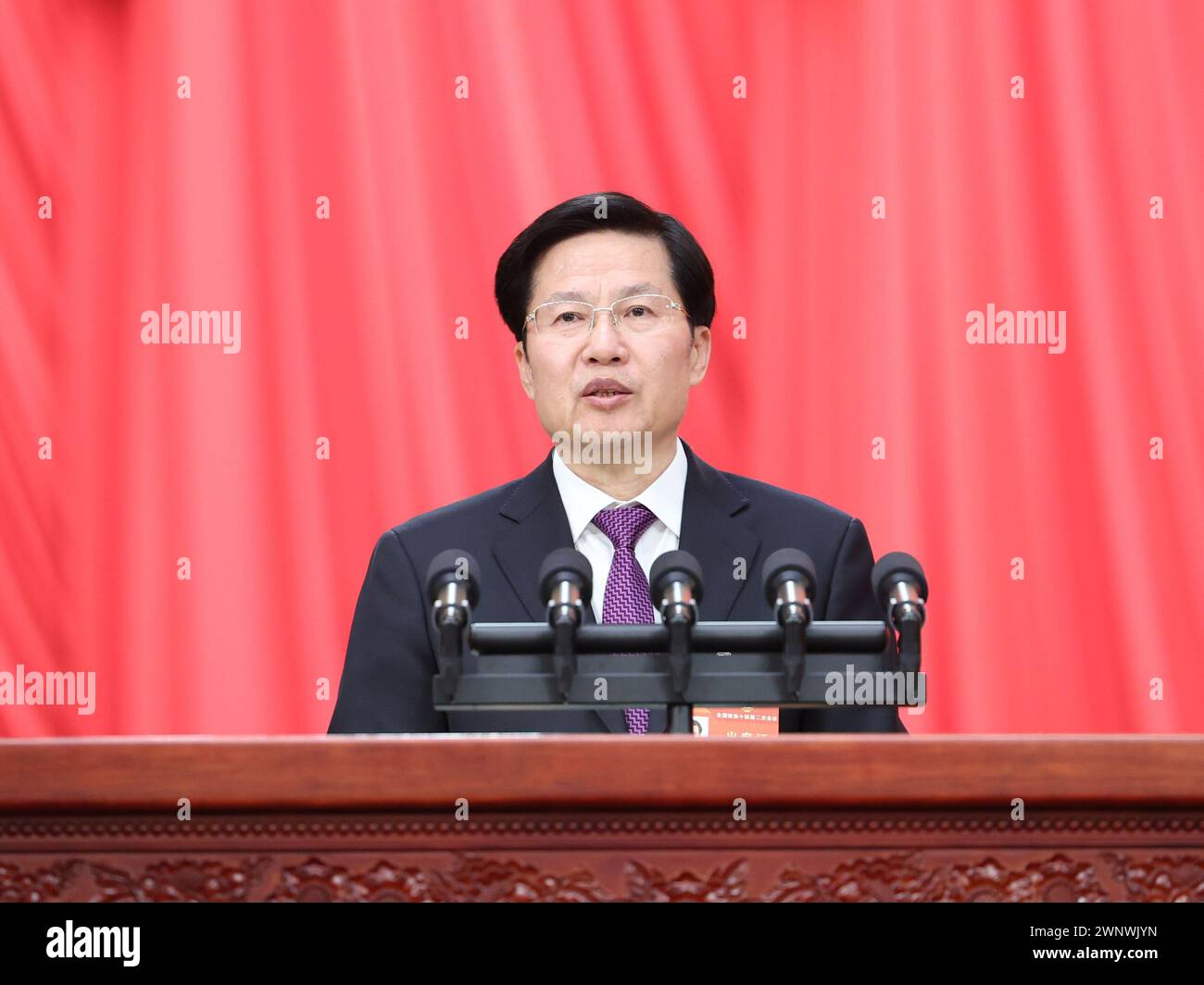 Beijing, China. 4th Mar, 2024. Gao Yunlong delivers a report on ...