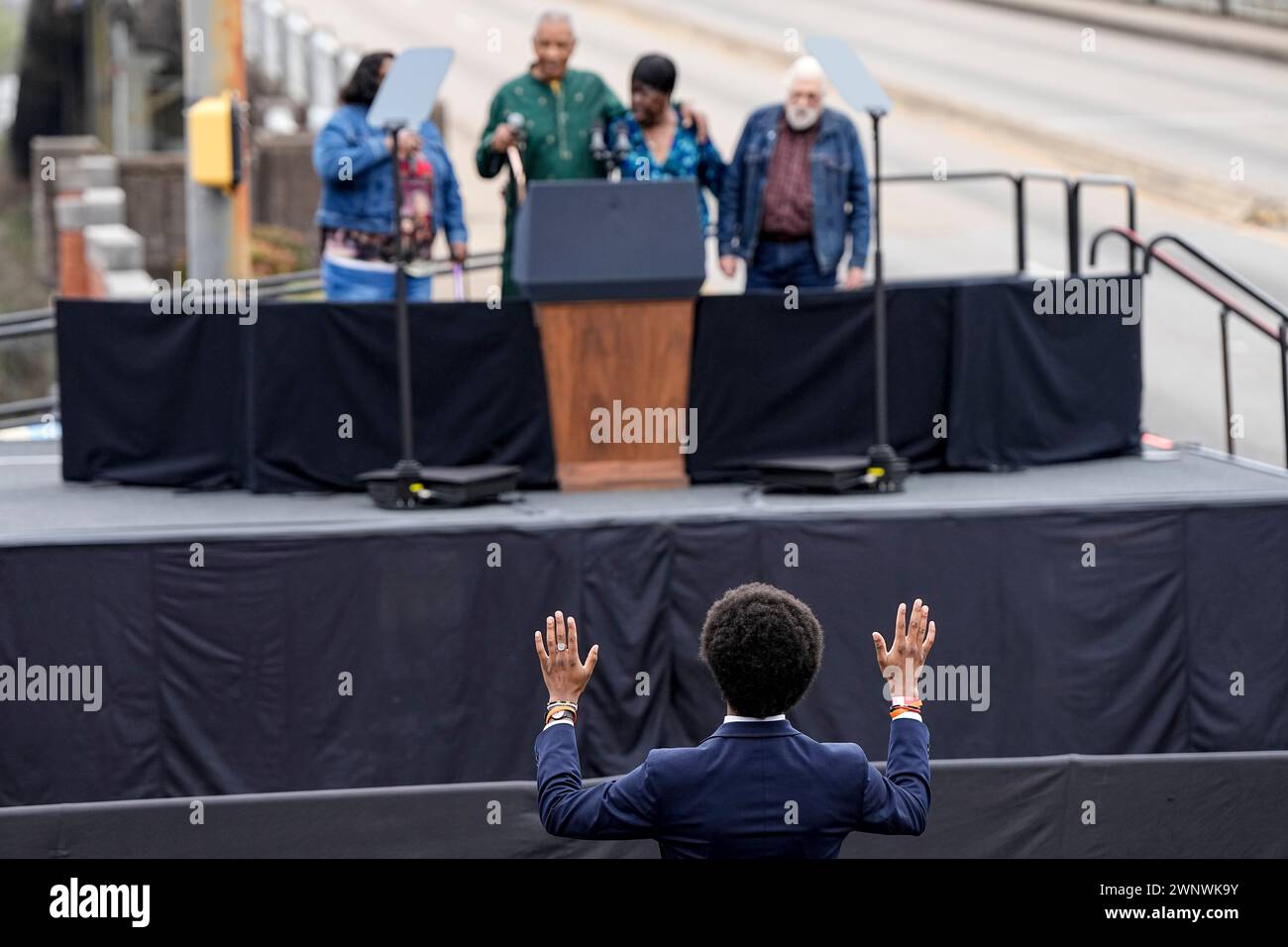 Tennessee state Rep. Justin Pearson raises his arms as people speak ...
