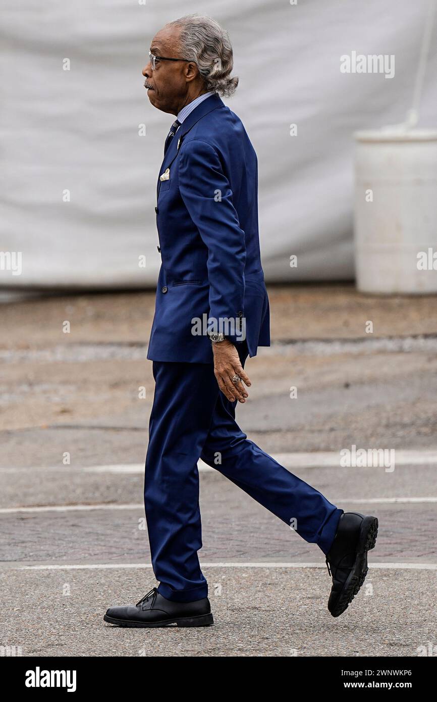 Al Sharpton walks before people gather and walk across the Edmund ...