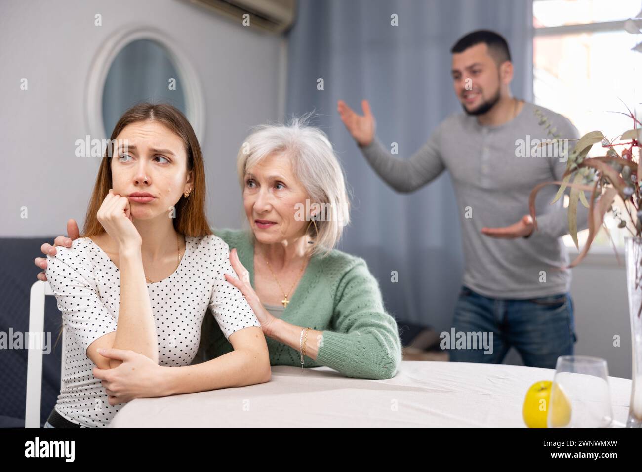 Quarrel Between Husband And Wife Senior Mother Comforting Adult
