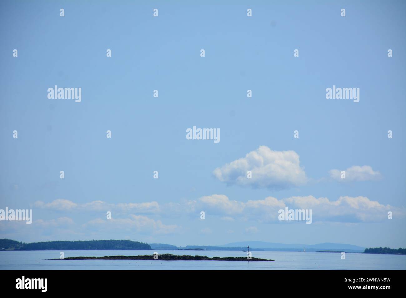 Horizon with island and landforms on Atlantic near Rockport, Maine ...