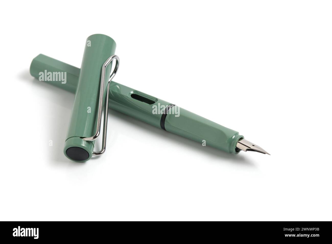 Fountain pen is green on white background Stock Photo - Alamy