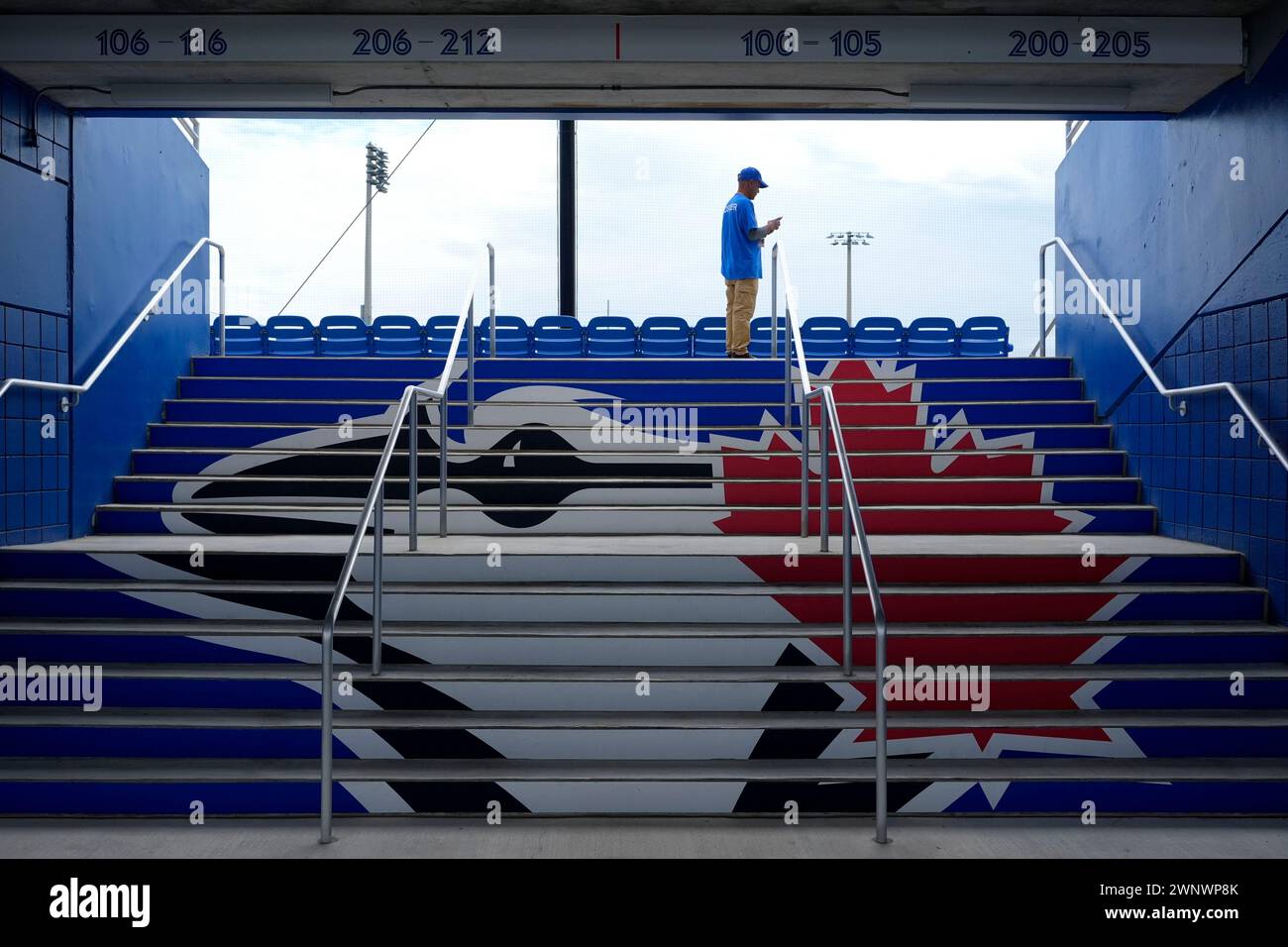 An usher waits for fans to arrive at TD Ballpark before a spring ...