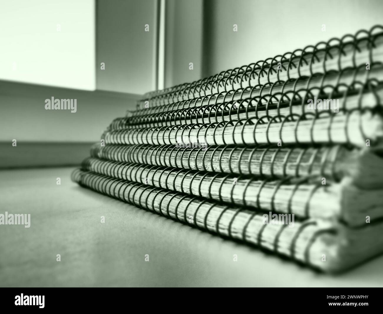 A stack of spring notebooks. Thick notebooks or notebooks placed on top ...
