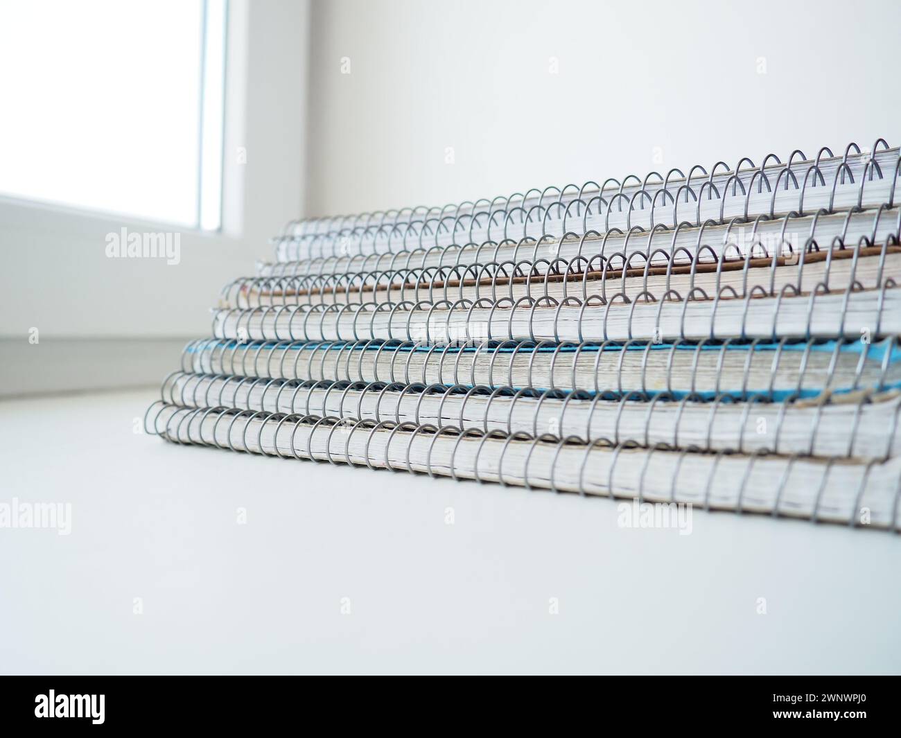 A stack of spring notebooks. Thick notebooks or notebooks placed on top ...