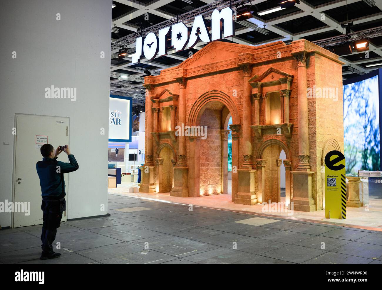 Berlin, Germany. 04th Mar, 2024. A man photographs a replica palace ...