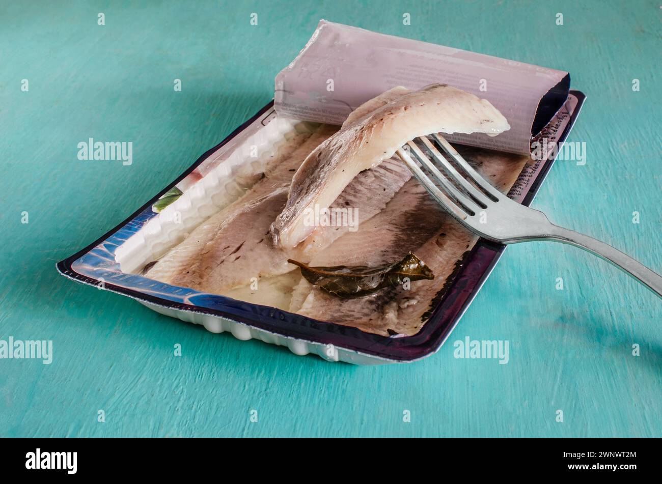 Pieces of fish fillet in marinade. Herring fillet. Fish fillet close-up ...