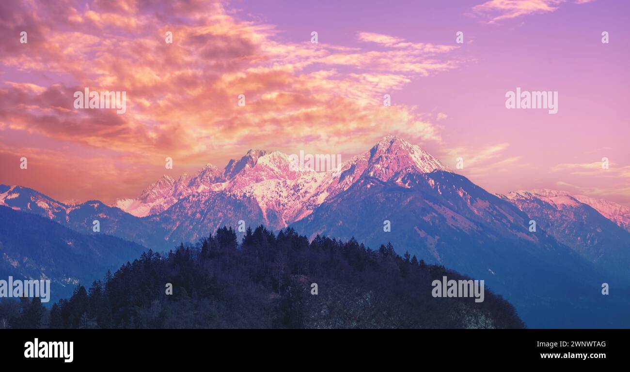 View of the Alps in Kranjska Gora at sunrise. The tops of the mountains ...