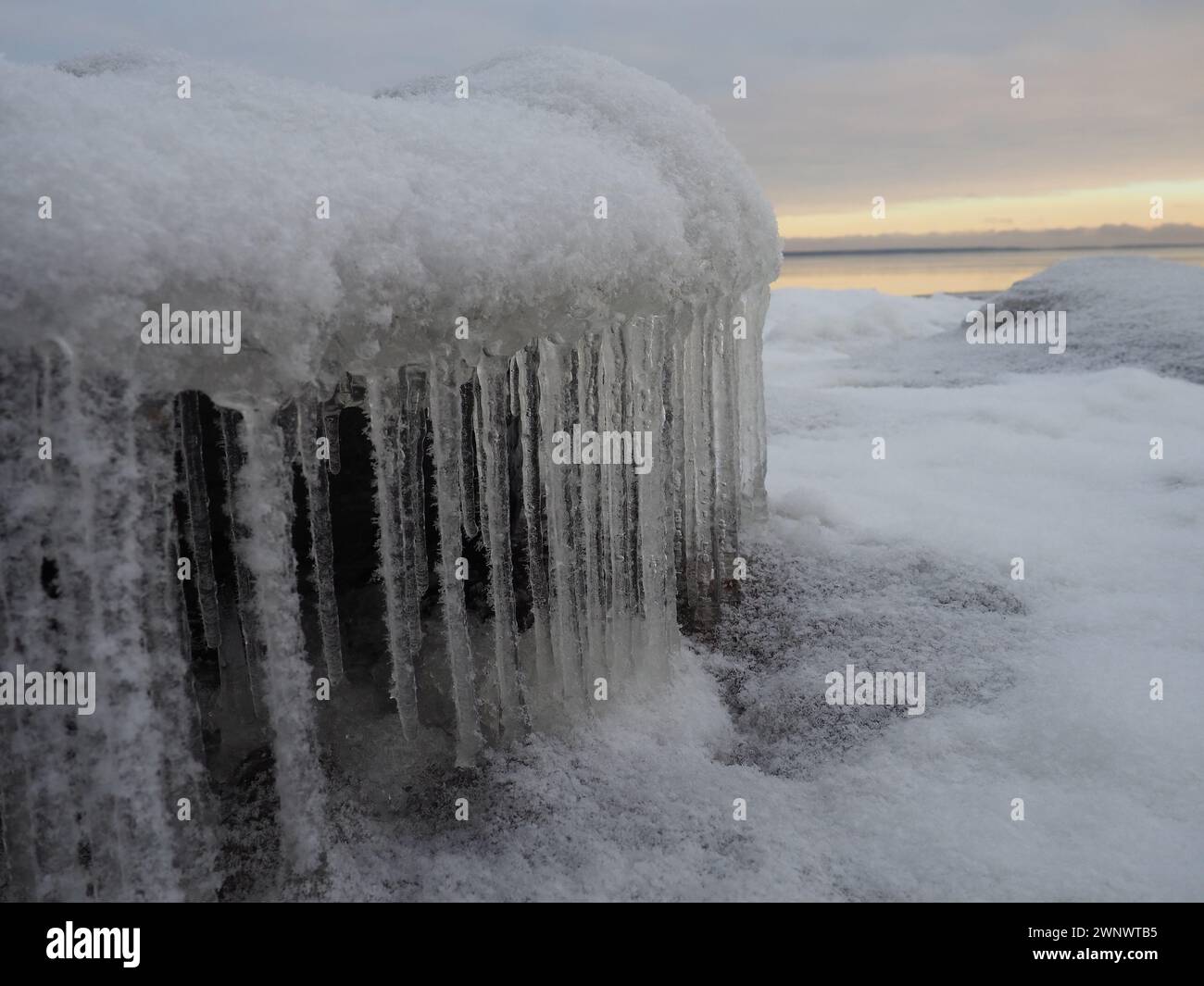 Ice icicles hanging down. Northern arctic winter season. Frozen nature ...