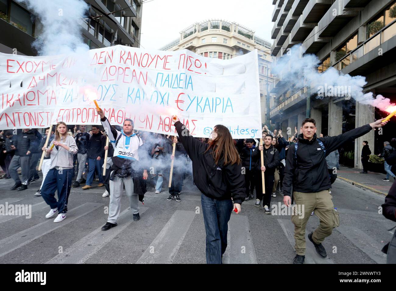 Students shout slogans during a protest in Athens. Thousand university ...