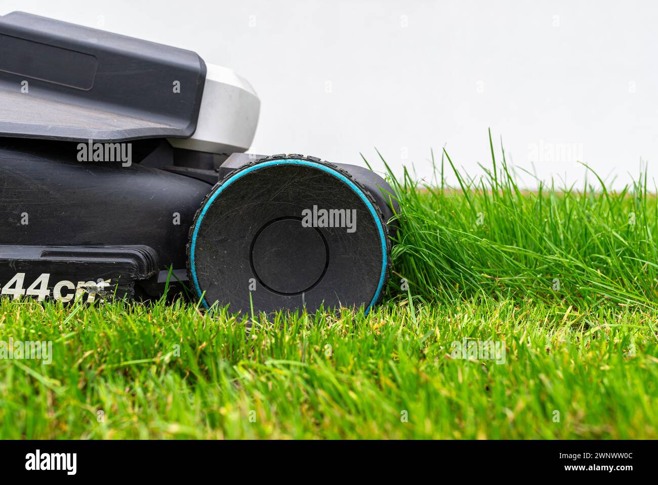 Mowing Grass With An Electric Powered Mower With A Cutting Width Of 44 Cm Visible Mown Rows